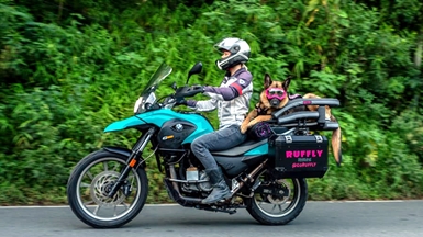 Jess Stone and her German Shepherd are touring the world on a motorbike ...